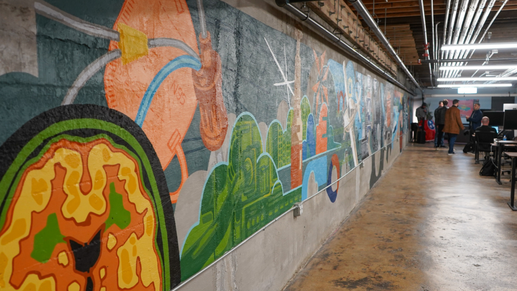 121 Tech Hub unveils basement level with new desks, mural, and event ...